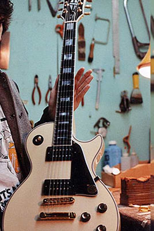 Refinishing and refretting with Gibson style binding