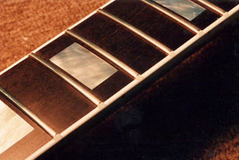 Refinishing and refretting with Gibson style binding